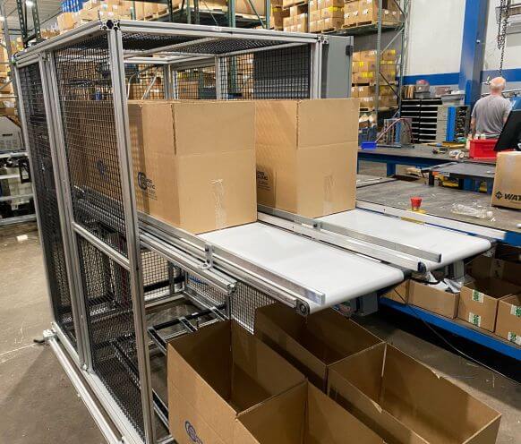 Robot & Mini-Mover Conveyors Automate Box Filling - Mini-Mover Conveyors